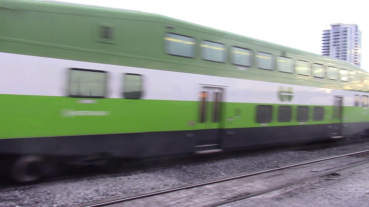 GO Transit trains meet at Pickering station. - YouTube