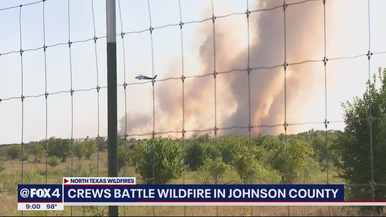 Crews battle wildfire in Johnson County - YouTube
