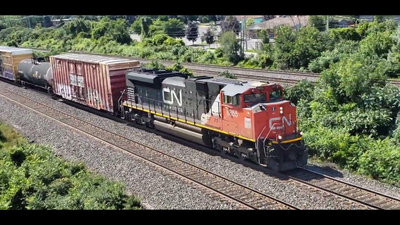 TRAINS CN Mixed Freight Eastbound at Beaconsfeild Footbridge with SD70M-2 Engines - YouTube