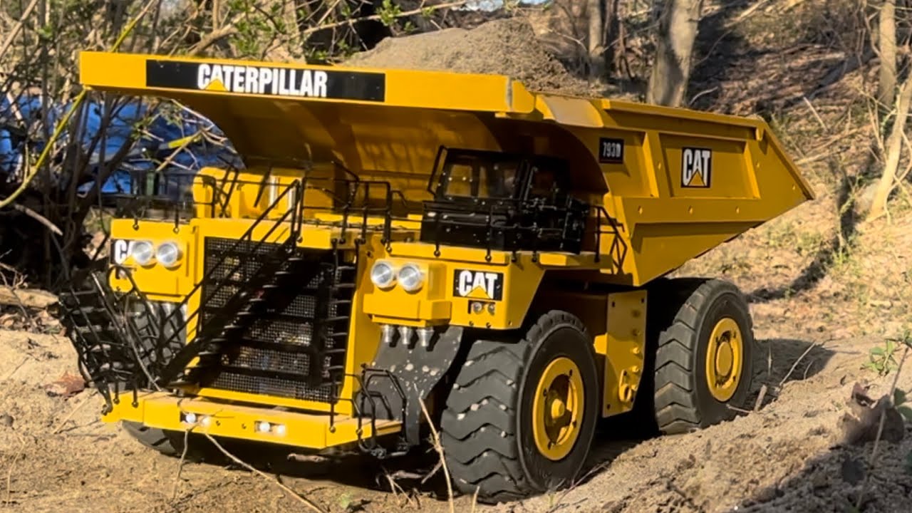 Cat 374f & 1/20 Cat 793D mining truck helping at the hotel building ...