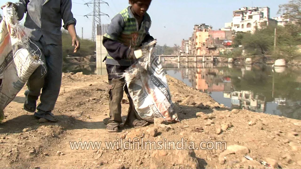 Terrible living conditions of under-age rag pickers in India - YouTube