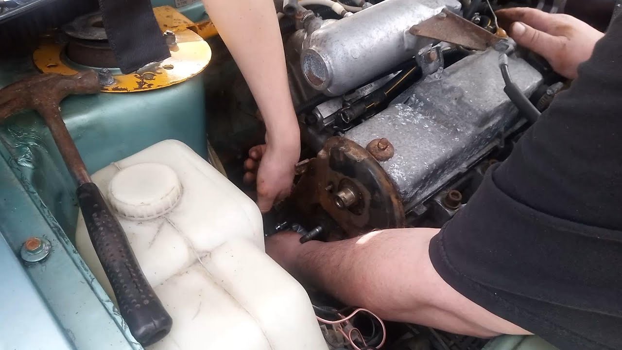 Fixing lada's water pump - YouTube