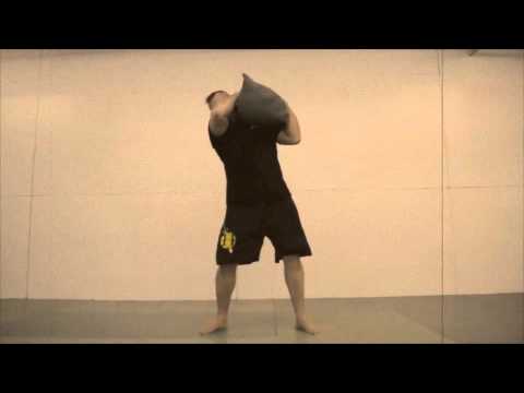 Sandbag lifting to shoulder - YouTube