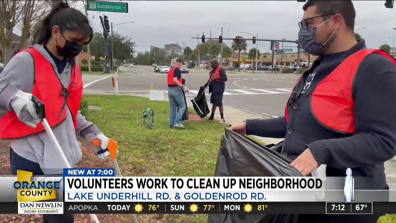 Volunteers work to clean up neighborhood - YouTube