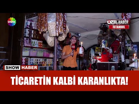Karanlığa gömülen esnaf mum ışığında aydınlanıyor