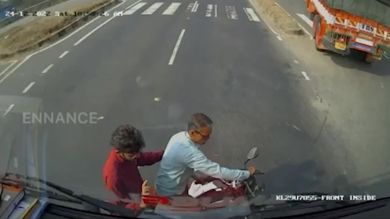 Biker Escapes miraculously From Fall Under Truck, Thanks to Driver ...