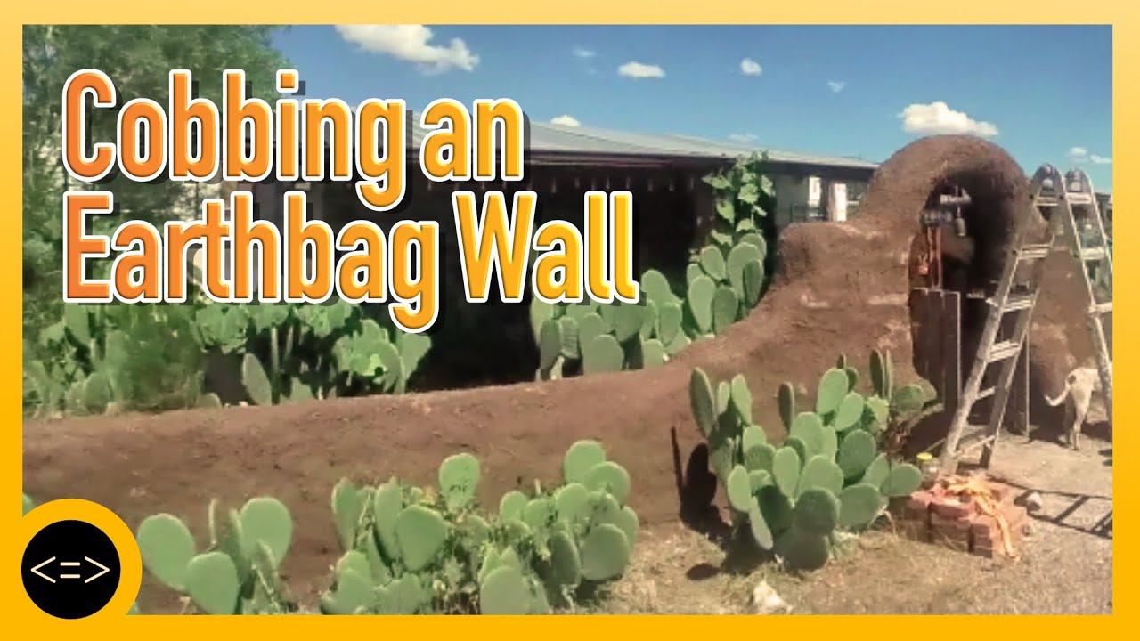 Cobbing an Earthbag wall with friends - YouTube