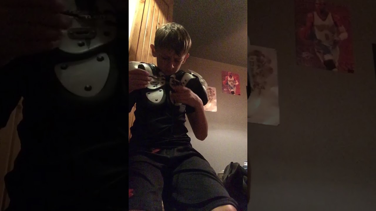 Putting on football gear - YouTube