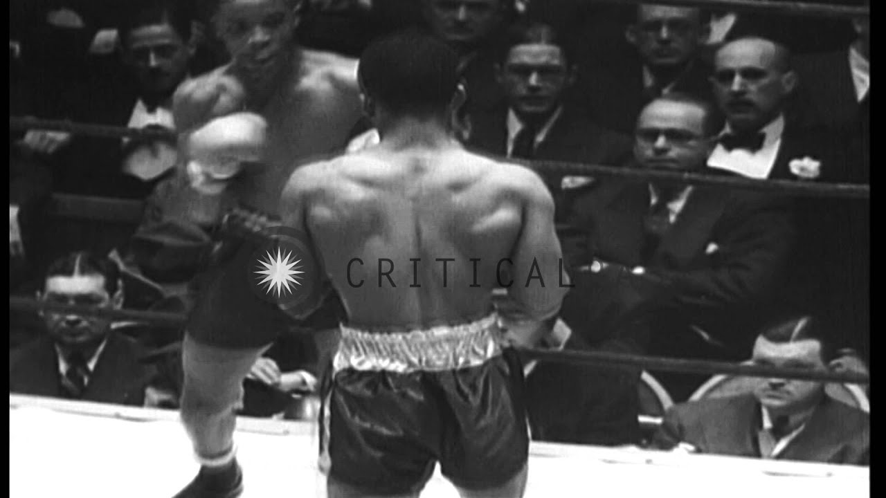 Spectators cheer boxers in ring during Golden Glove tournament at ...