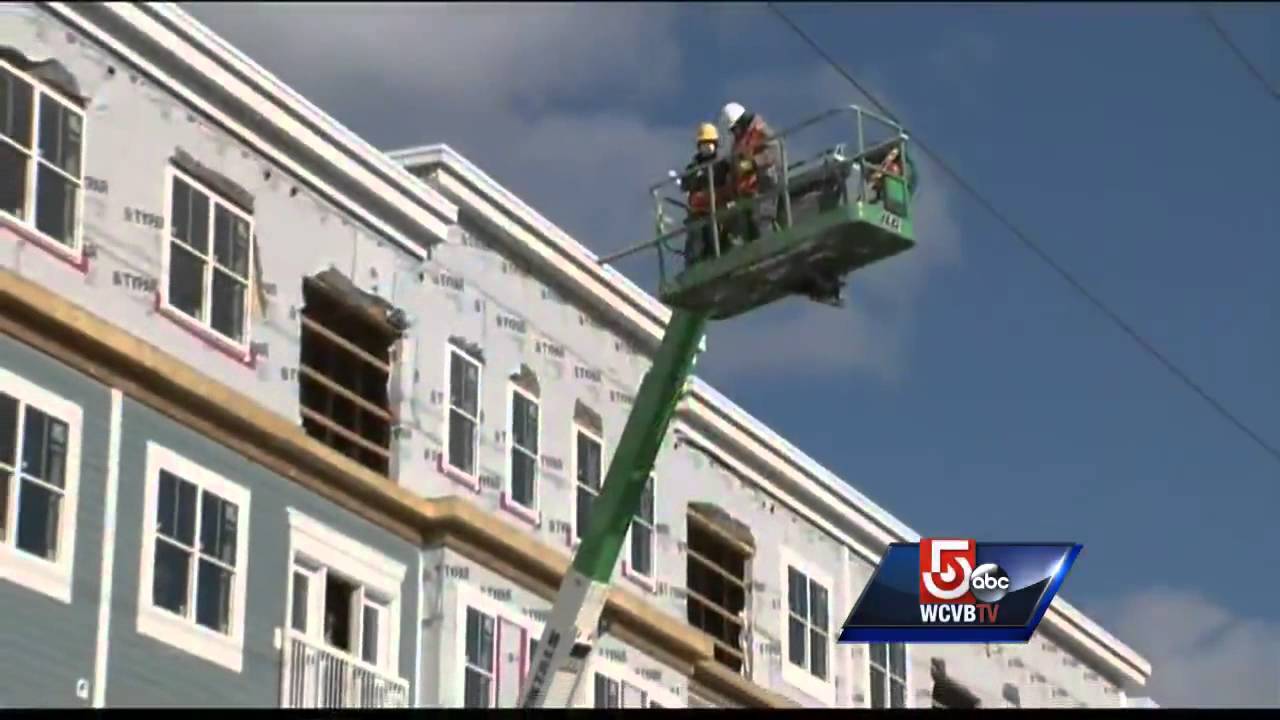 Workers stuck after cherry-picker gets too close to live wires - YouTube