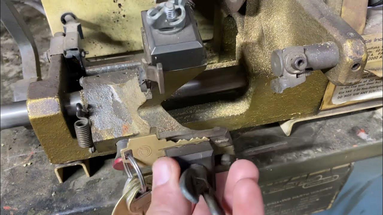 Curtis key cutter model 2000 with key display rack - YouTube