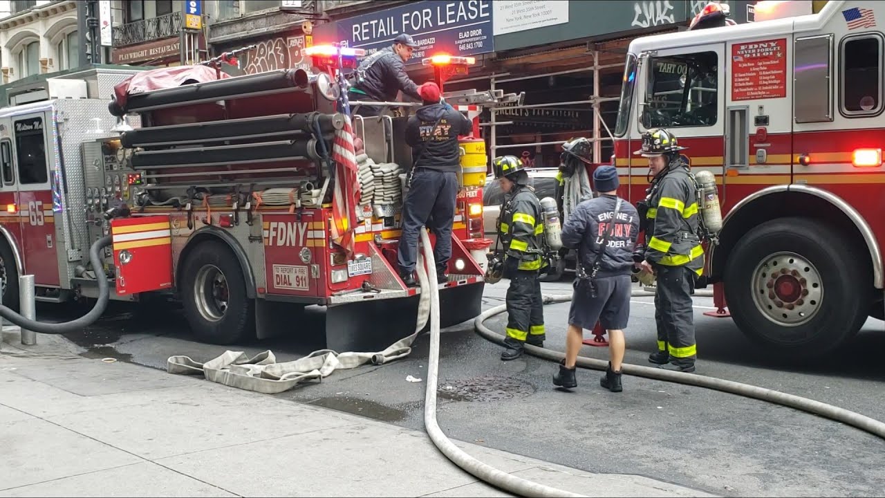 FDNY engine 65 and tower ladder 7 operating at a parking garage with ...
