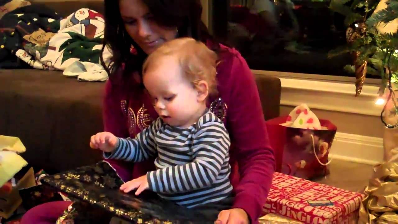 Matthew unwrapping gifts from Aunt Kendra - fish puzzle - YouTube