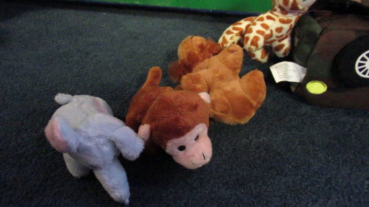 Stuffed animals: Safari and friends, Mickey Mouse, Pluto, Moose coin ...
