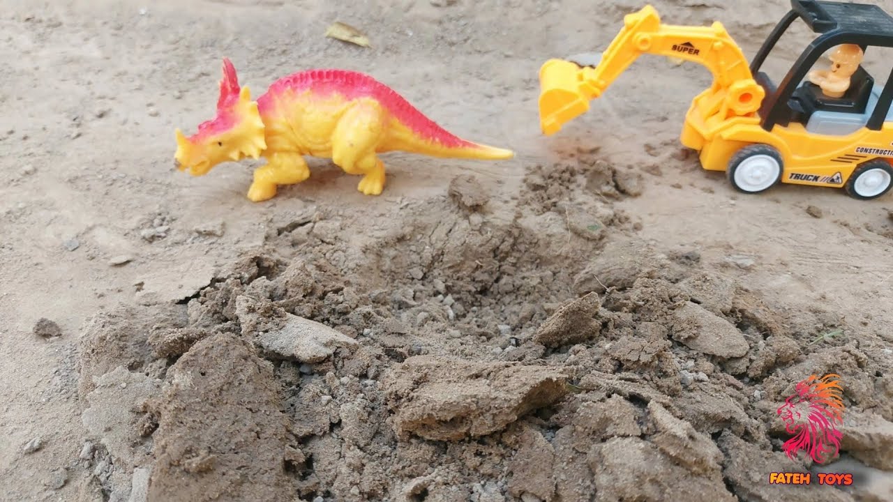 Dinosaur toys in sand dino toys mud dinosaur plastic stuck in sand ...