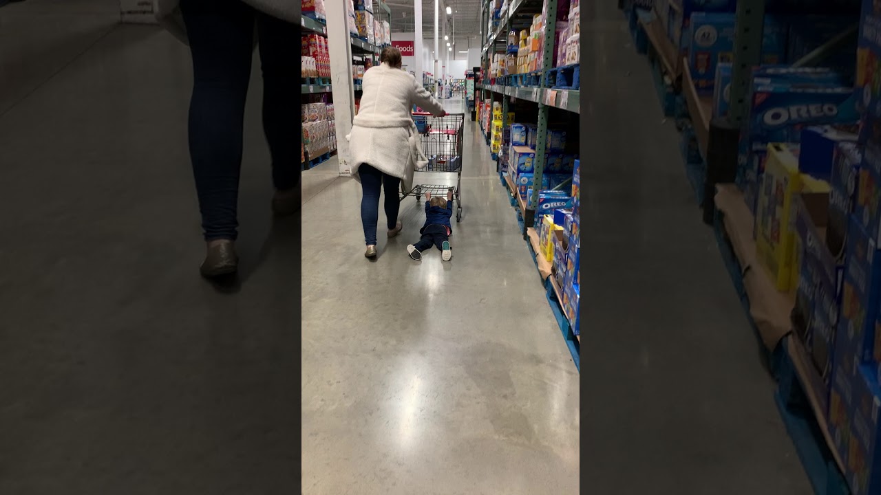 Toddler holding on cart while being dragged on the ground. - YouTube