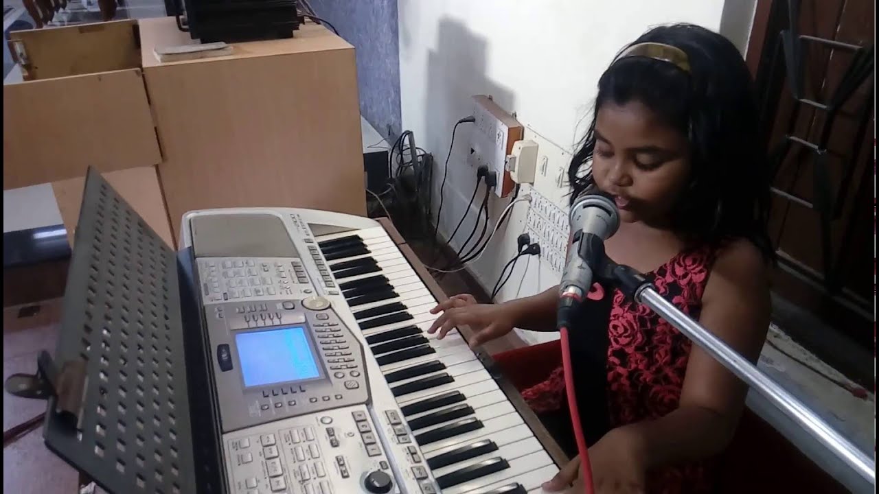 Sharon Christopher Davidsinging and playing keyboard ...Father God i ...