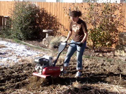 Rototilling in the garden soil amendments. - YouTube