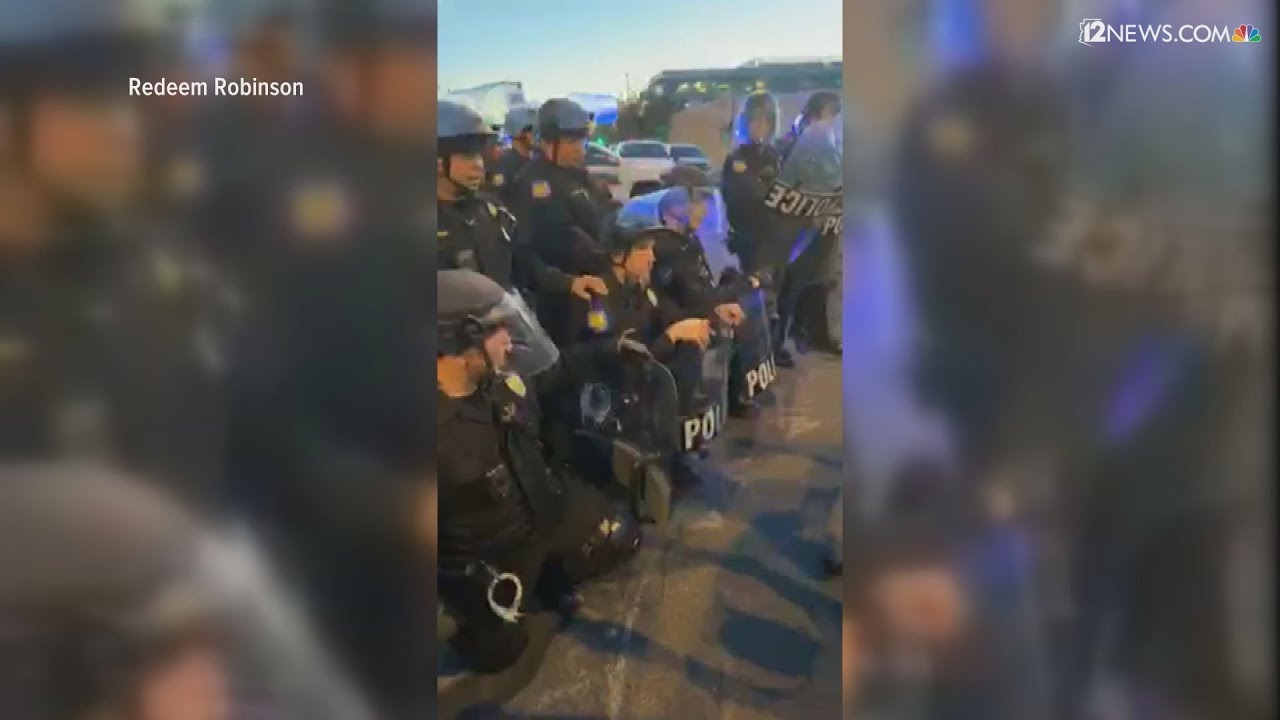 'Understand how we feel': Phoenix police officers took a knee with ...