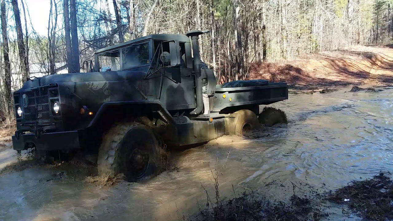 5 ton and deuce big mud hole - YouTube