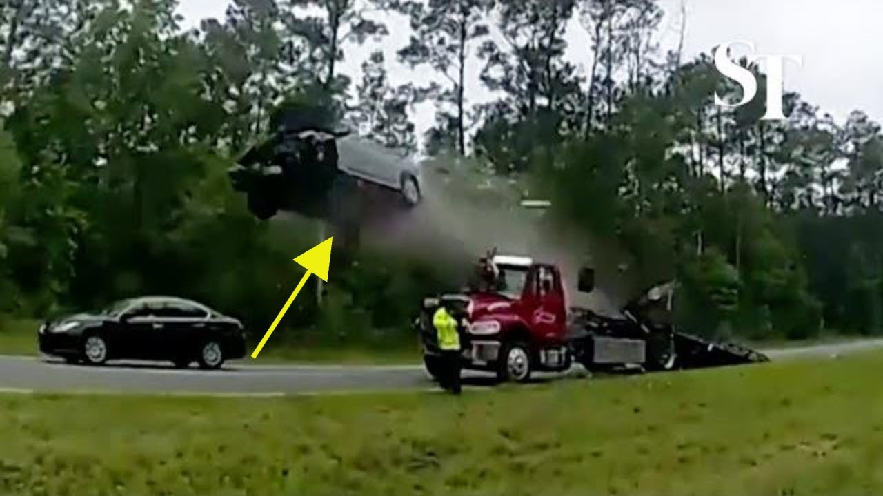 Car launches into air after hitting tow truck ramp - YouTube