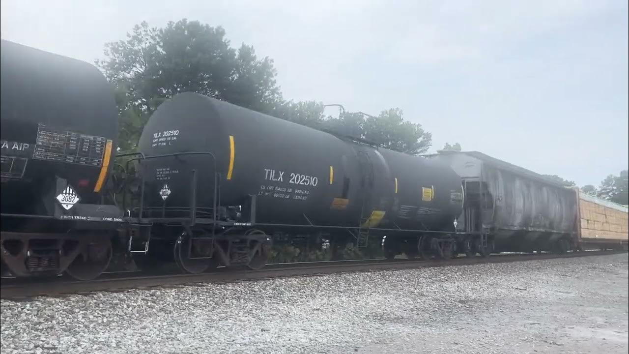 154 With a ATSF boxcar & a ACe Imposter on July 4, 2023 under cloudy skies & a Loaded lumber car ...