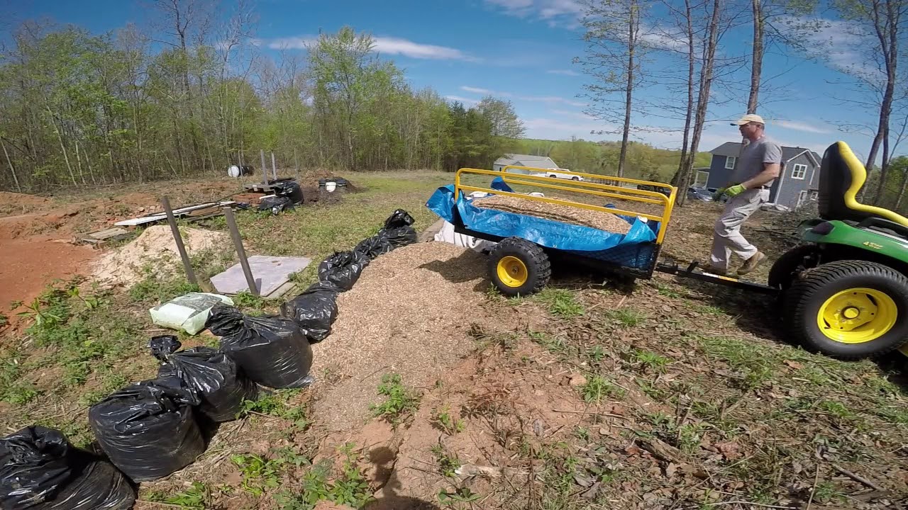 Polar Mesh Trailer and John Deere x584 Hauling Wood Mulch - YouTube