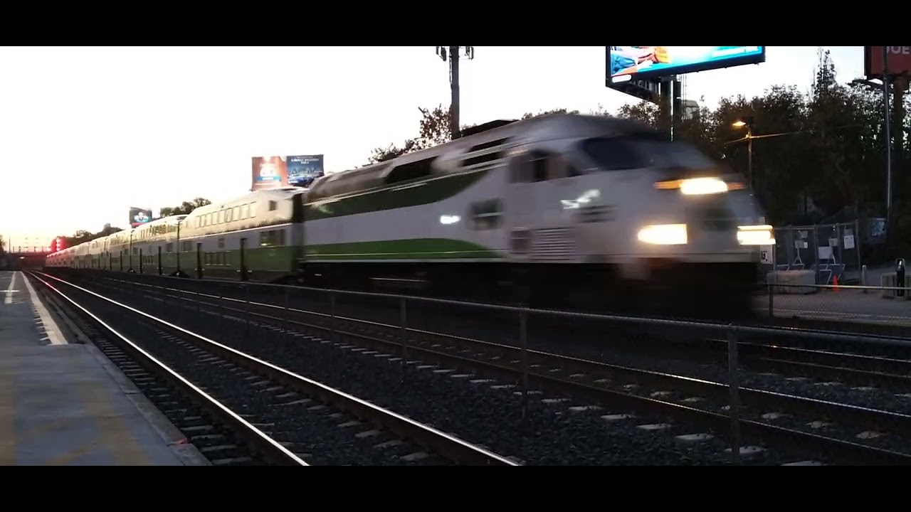 Go transit train flying through exhibition Go station - YouTube