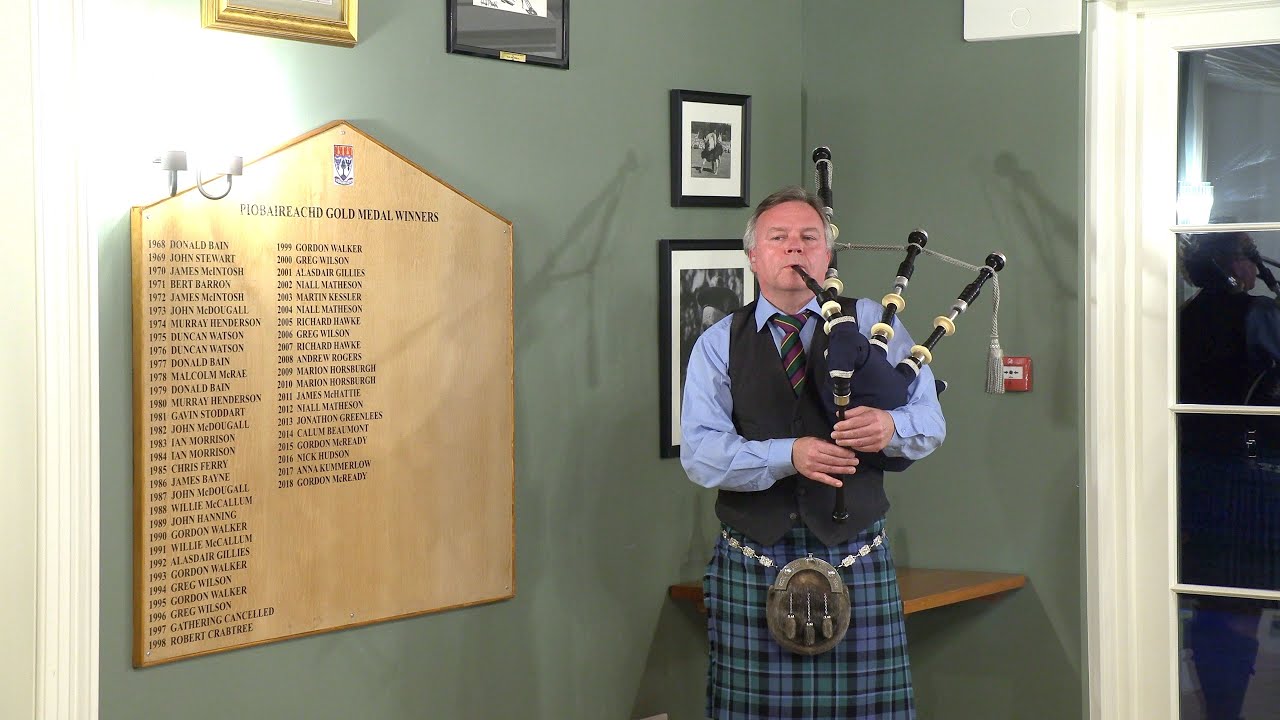 Champion Piper Stuart Liddell playing "The Braemar Gathering" during ...