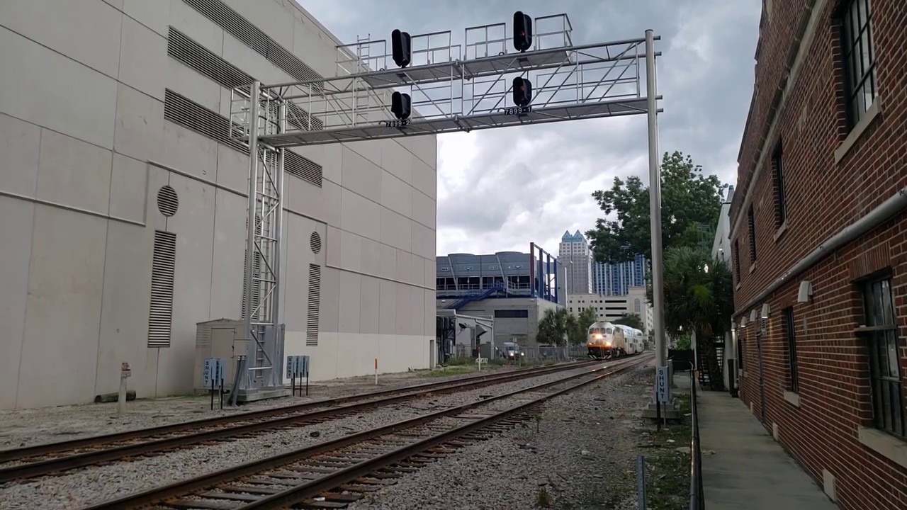 SunRail 110 with a nice new cast P5 makes a stop at Lynx - YouTube