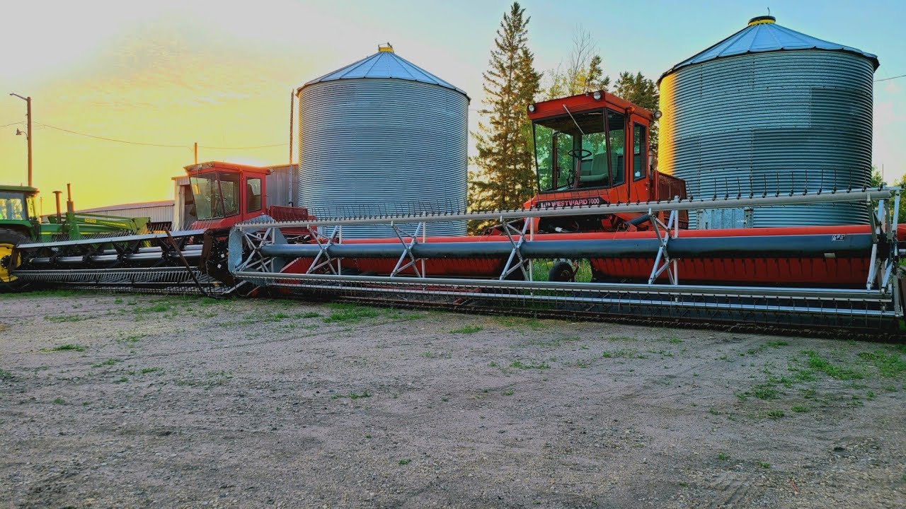 New swather! And the combines get a wash and the canola is sprayed ...