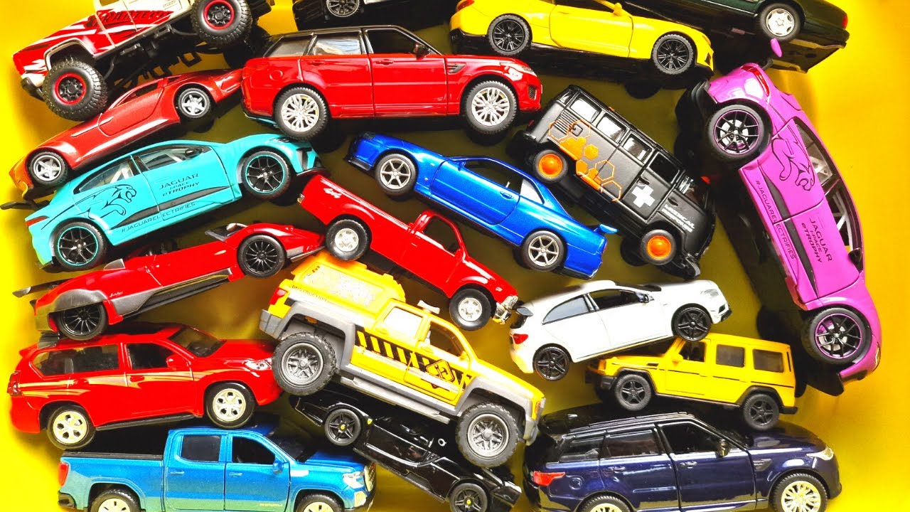 Selection of various model cars from yellow box - YouTube