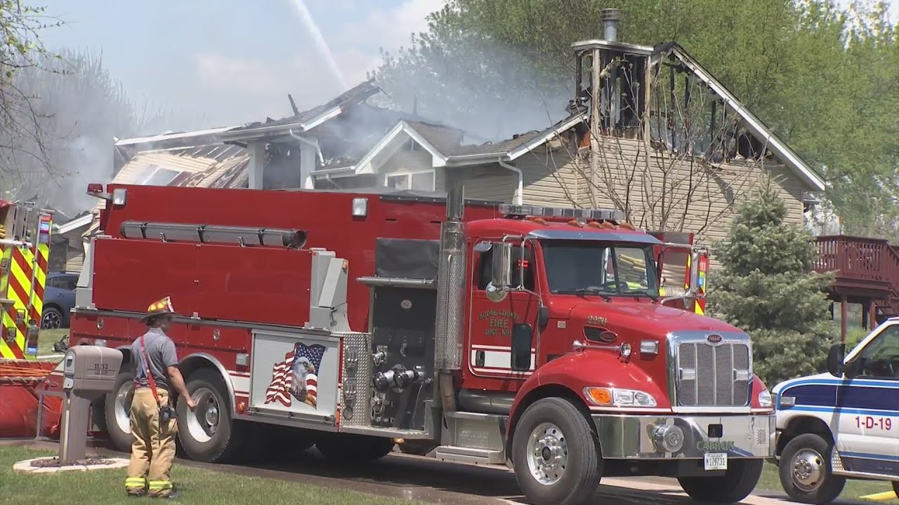 Firefighters battle 2 story house fire in Roscoe - YouTube