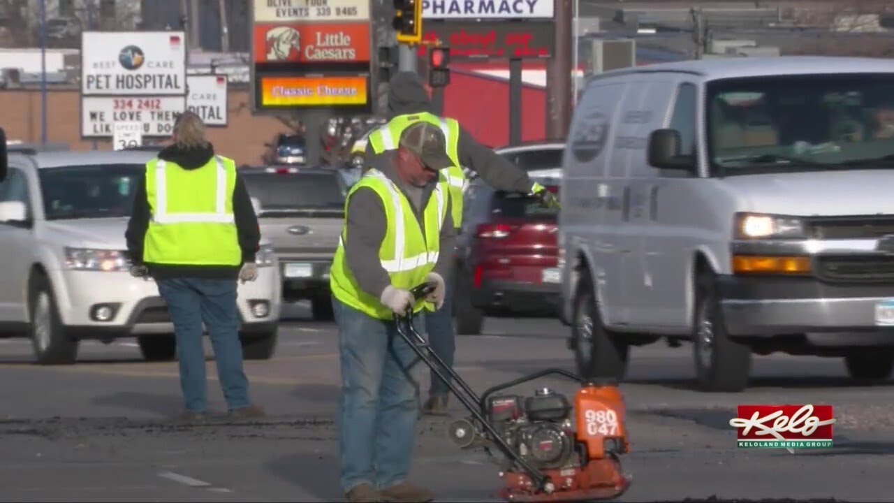 Patching potholes ahead of weekend rain - YouTube