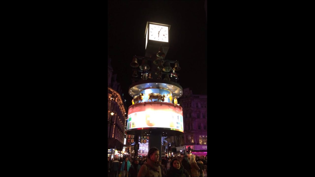 Famous Swiss Clock on Leicester Square in London - YouTube