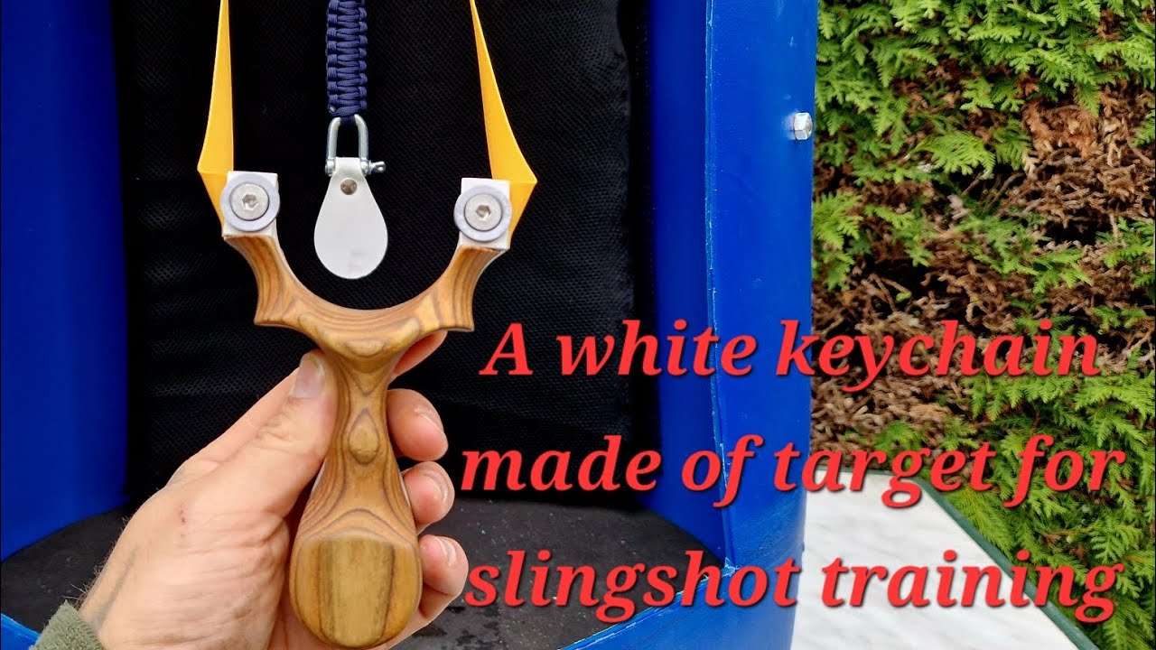 a white keychain made of target for slingshot training, full butterfly ...