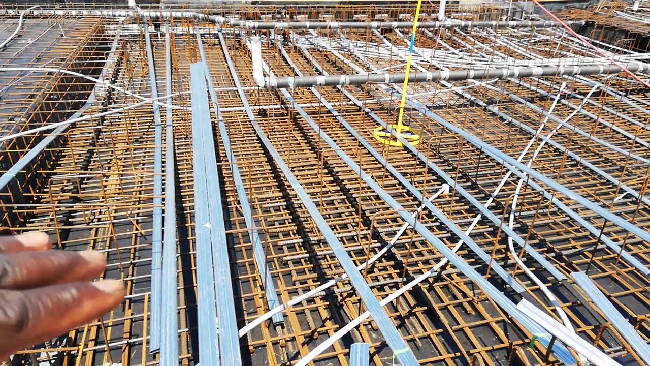 Steel work and stressing cables at work complementing each other. - YouTube