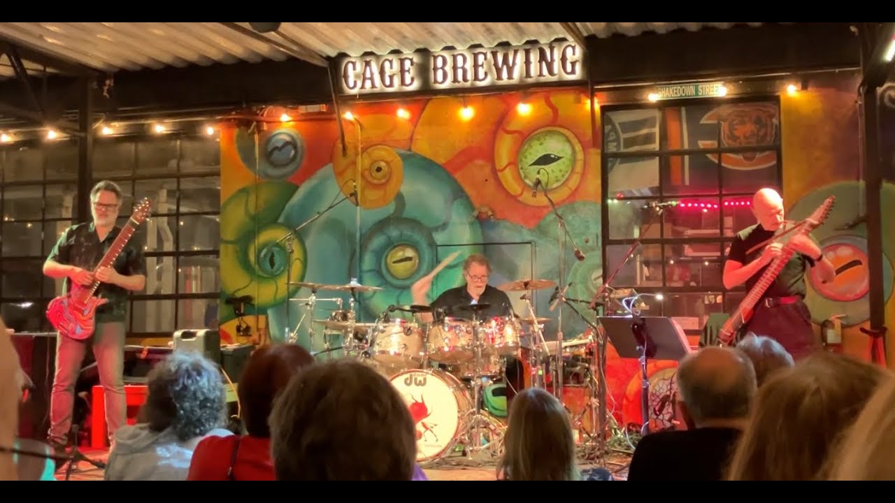 Stick Men performing progressive experimental rock tune at Cage Brewing ...