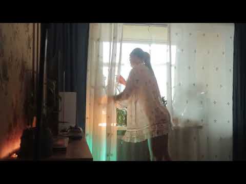 Transparent watering houseplants with model girl in a dress