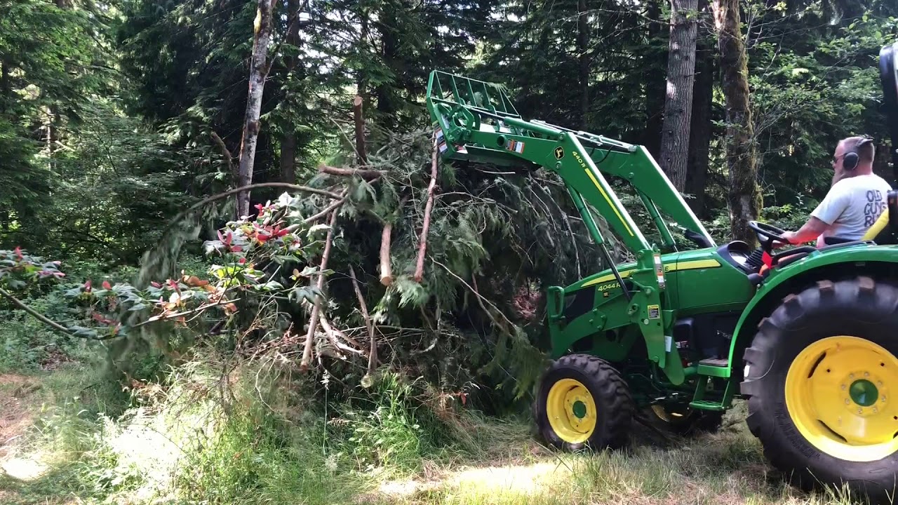 Tractor logging with a 2018 John Deere 4044R with forks - YouTube