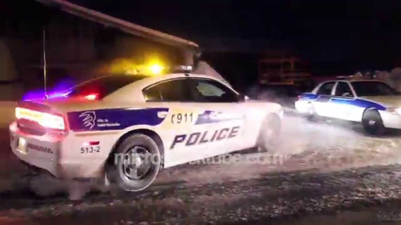 Modern looking police car on snow at night - YouTube