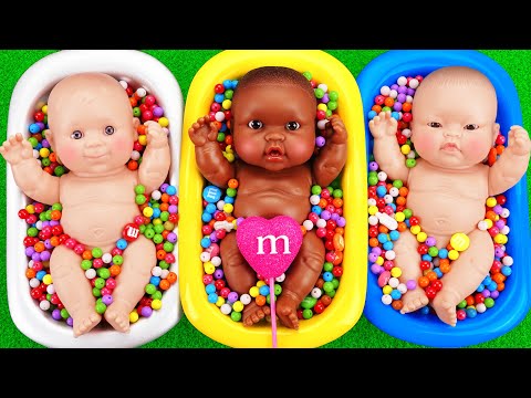 Mega Candy Tub Overflow! M&Ms + Slime Mix Bath with Cute Baby Dolls 😍🍬