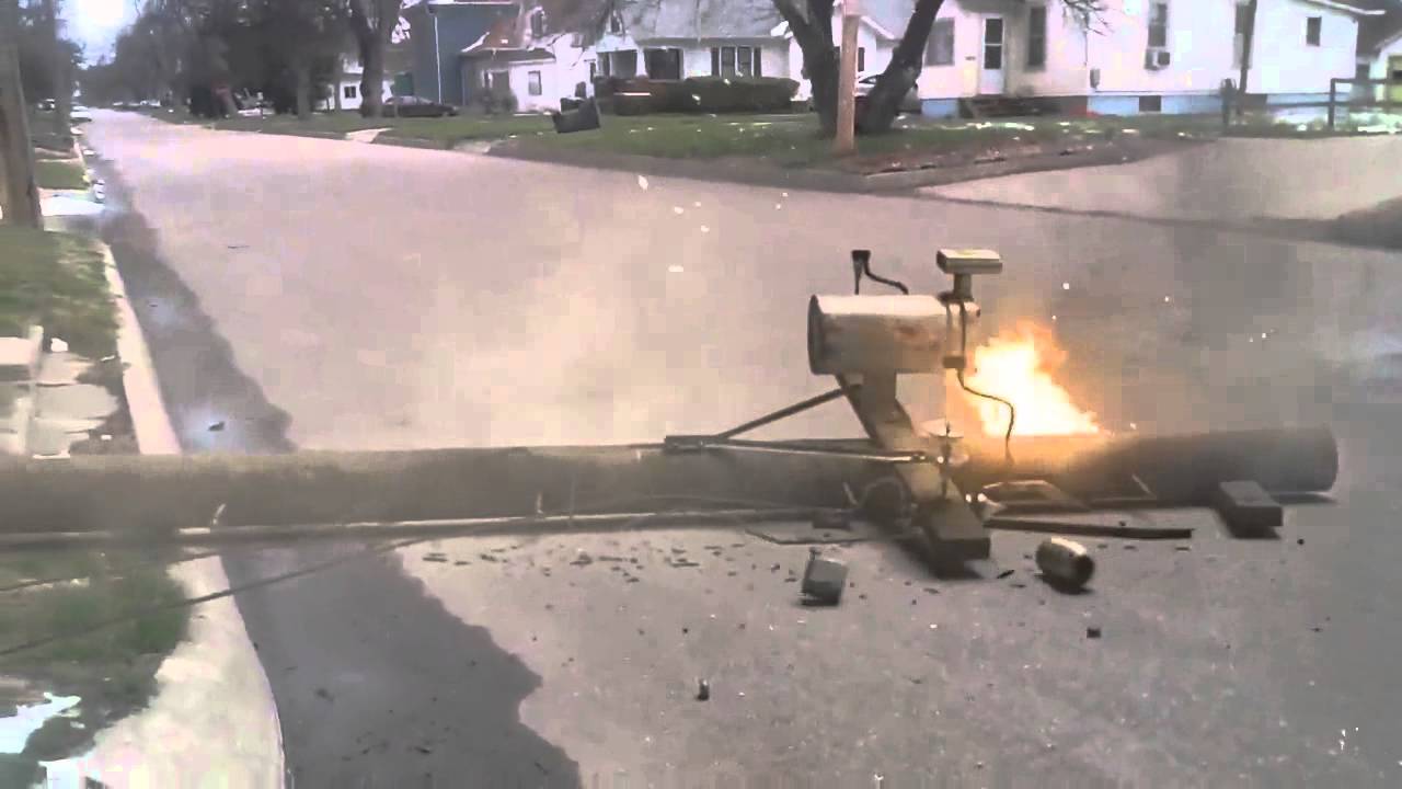 Power pole falls in street - YouTube
