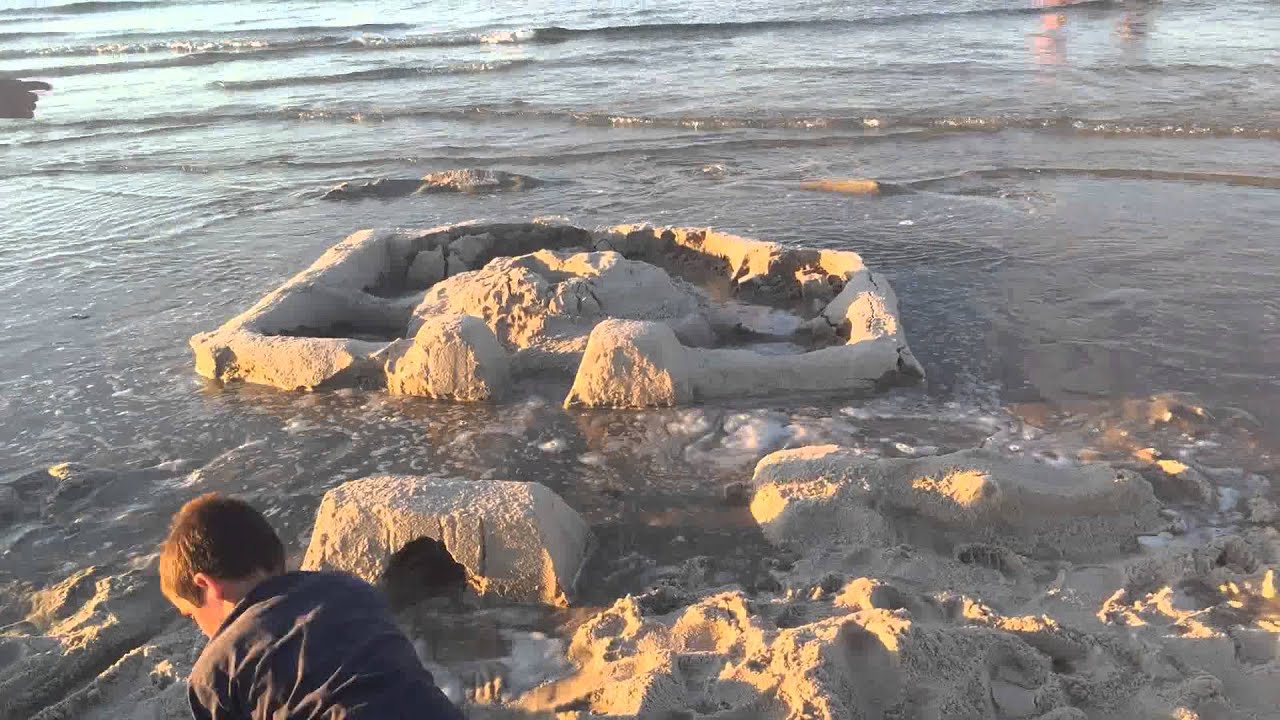 Huge Sand Castle vs waves: Time Lapse - YouTube