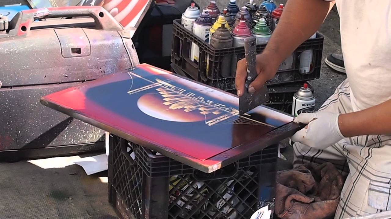 Artist on Embarcadero spray paint and scraper makes Golden Gate Bay ...