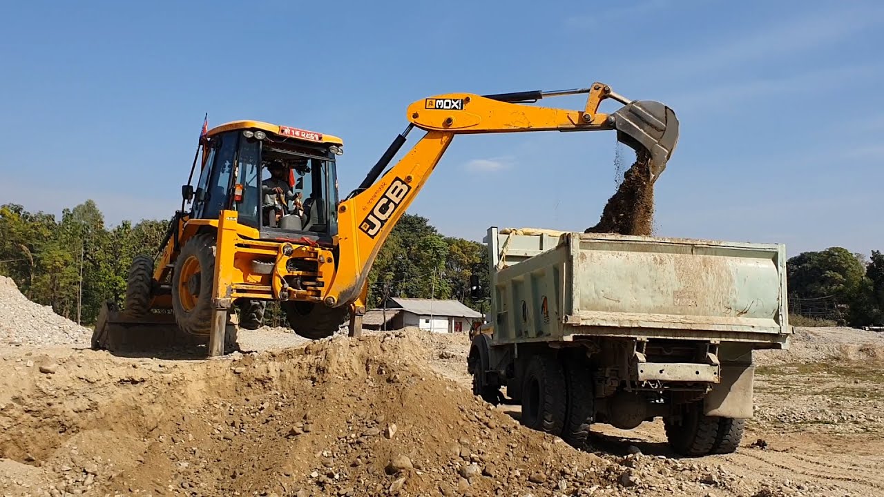 JCB Backhoe Loader Loading Dirt in Dump Truck - Dump Truck Carrying ...