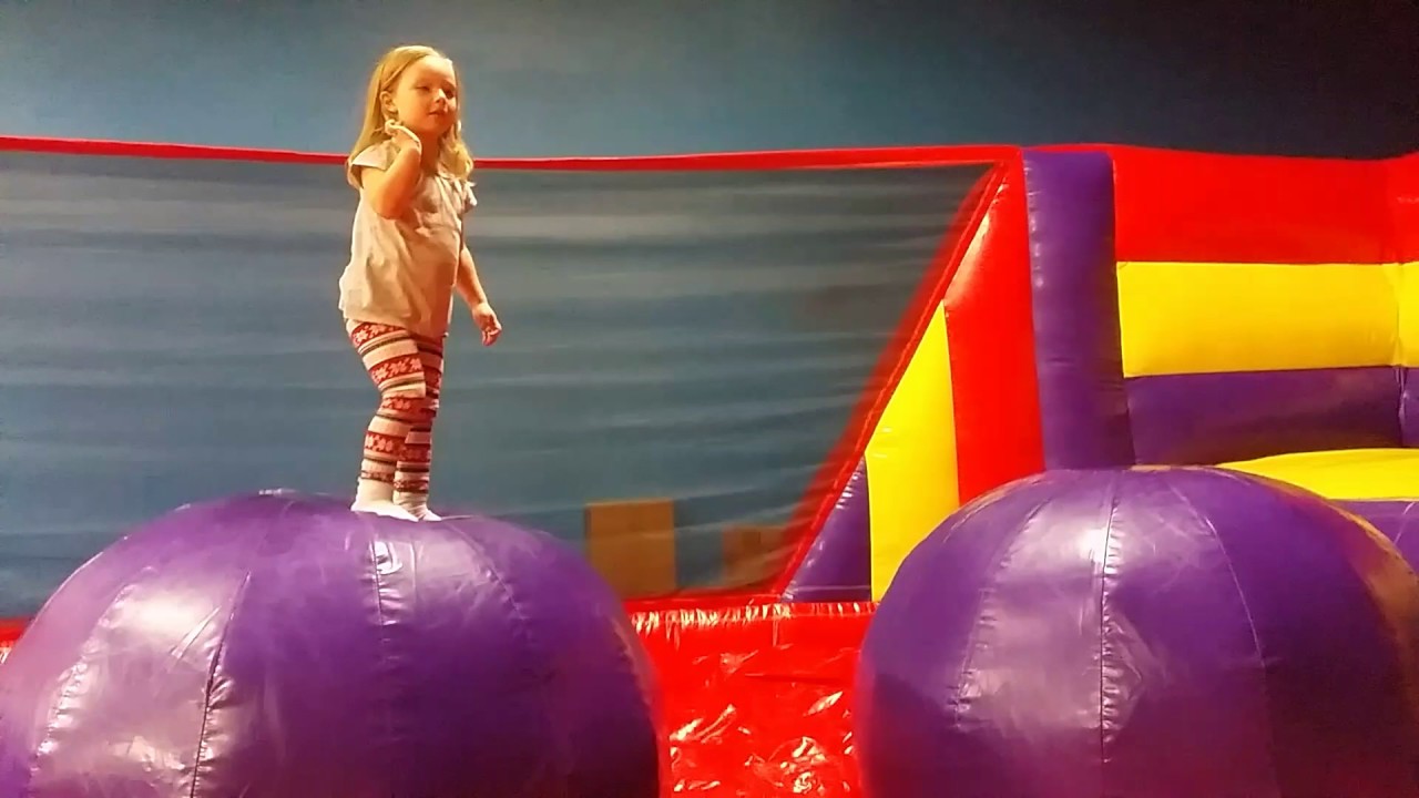 Autumn jumping across bouncey ball obstacle course - YouTube