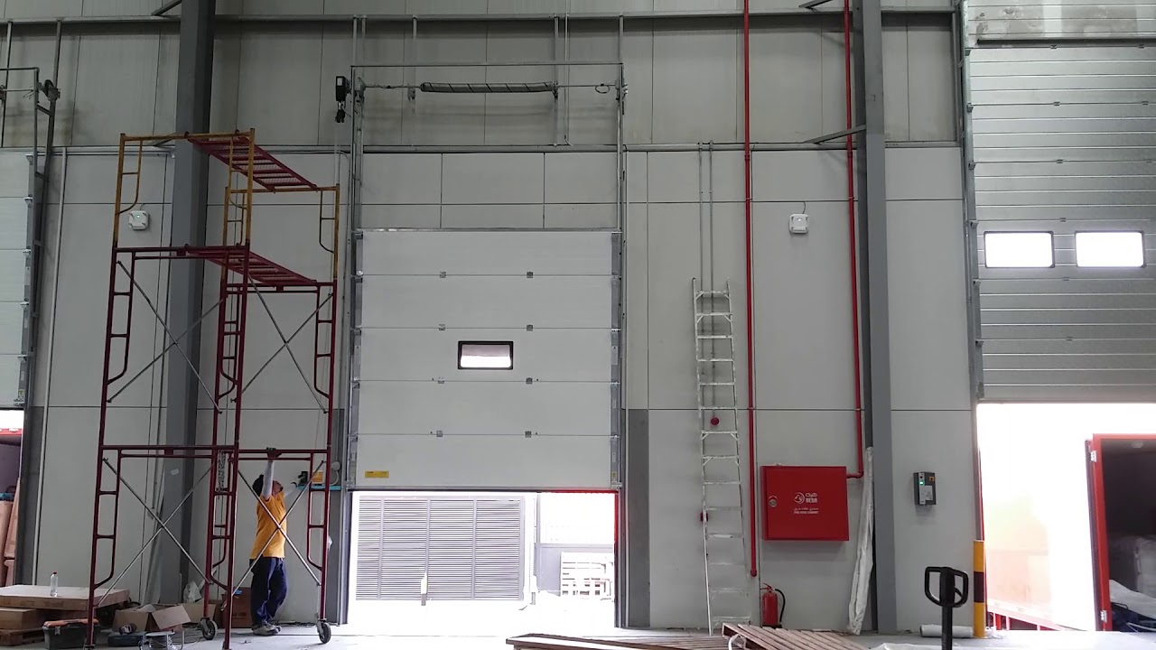 Gandhi automation sectional door - YouTube