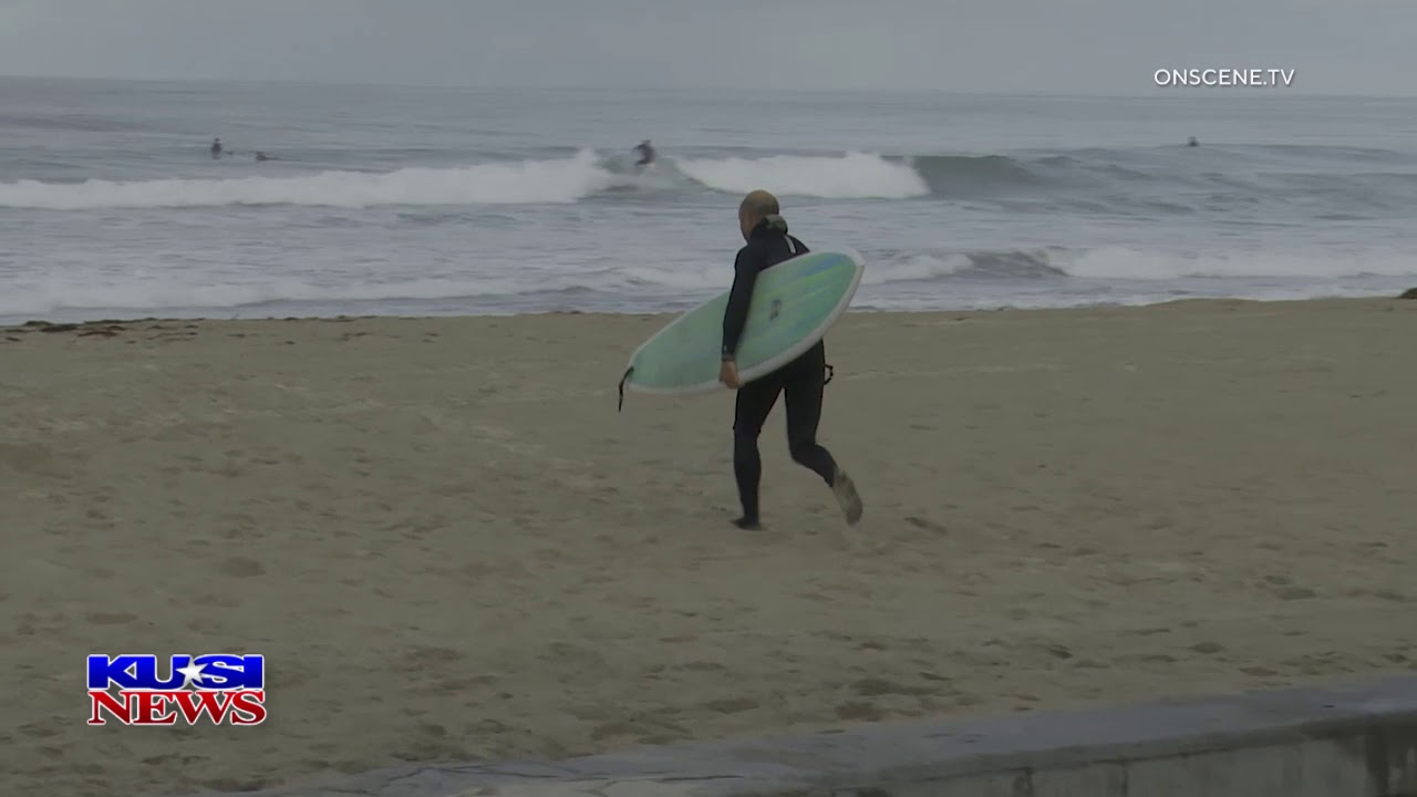 Surfer ignores San Diego Police telling him beaches are closed, goes ...
