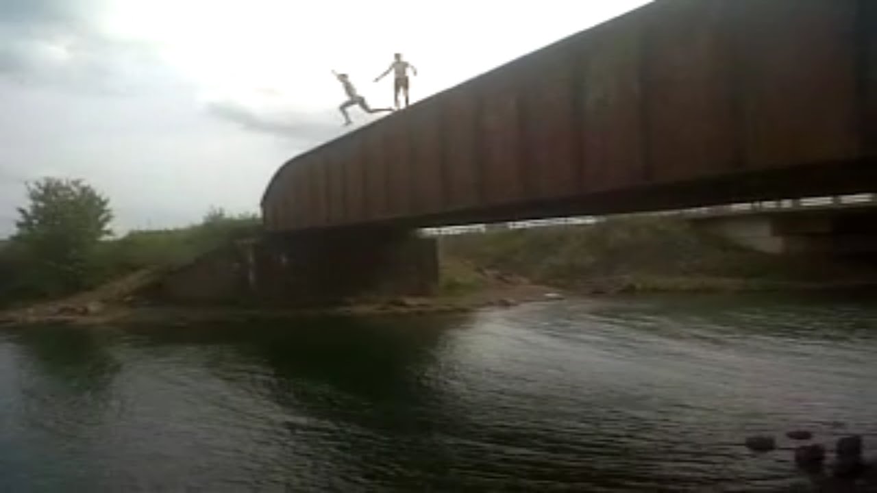 Boy and Girl Jump Off Train Bridge - YouTube